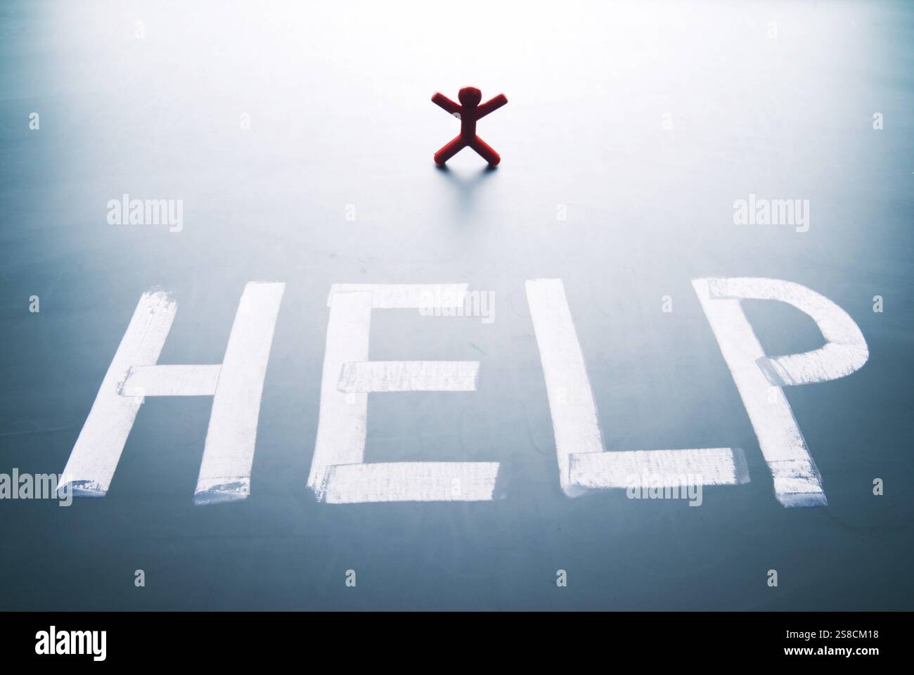 Heip word and single person with backlight shadow Stock Photo - Alamy