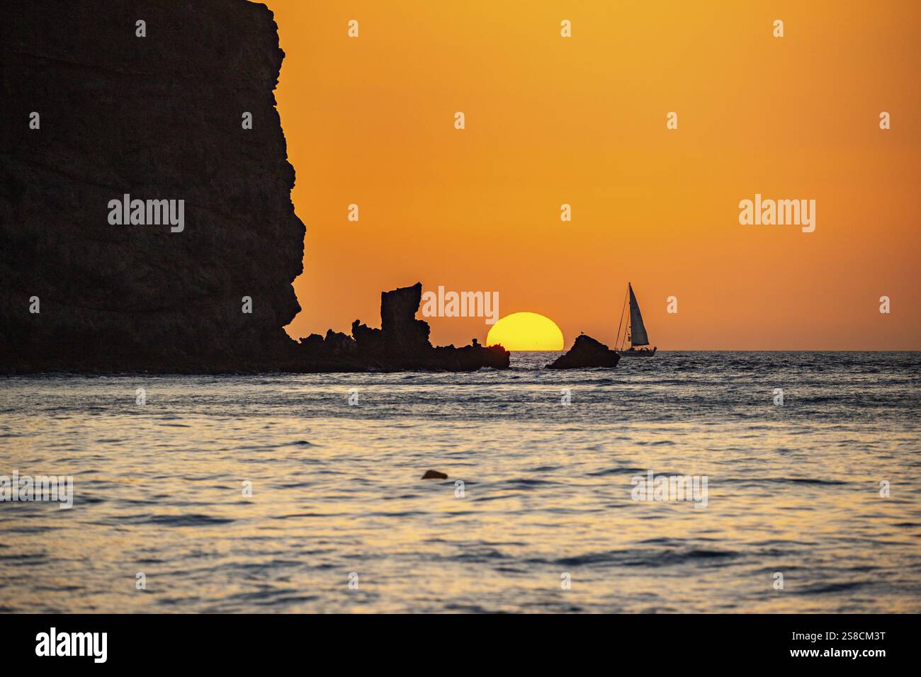 Sunrise during a sandstorm, Calima. The haze-covered horizon turns ...