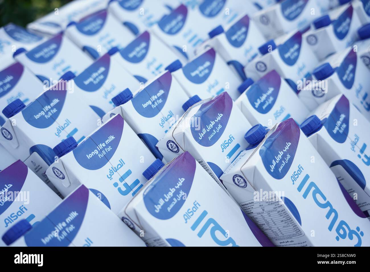 A neatly stacked arrangement of Al Safi long-life milk cartons, full ...