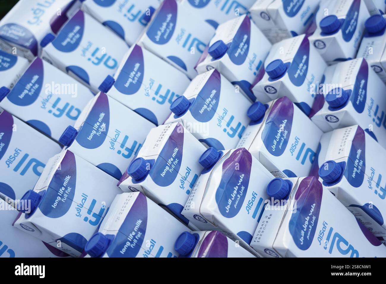 A neatly stacked arrangement of Al Safi long-life milk cartons, full ...