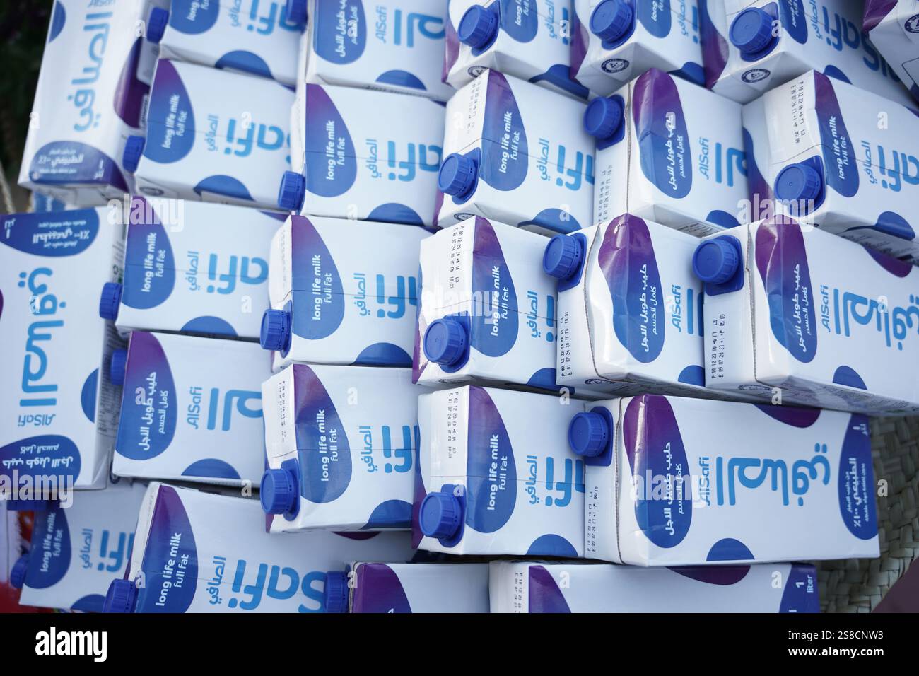 A neatly stacked arrangement of Al Safi long-life milk cartons, full ...