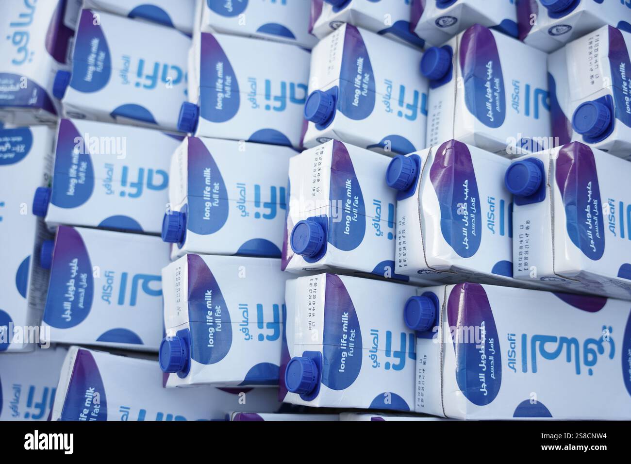 A neatly stacked arrangement of Al Safi long-life milk cartons, full ...