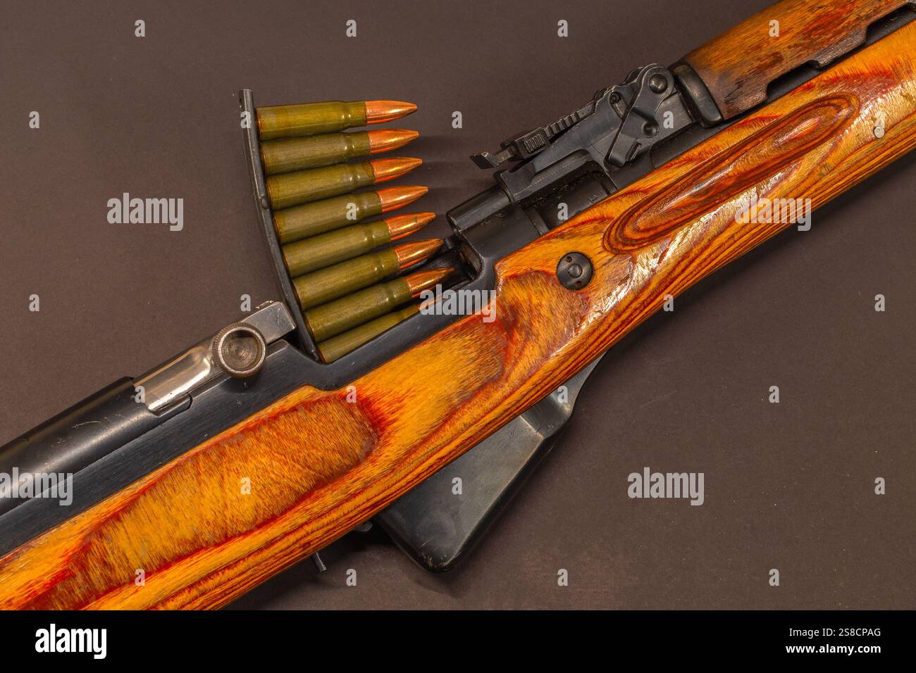 A close-up view of a classic semi-automatic rifle with a stripper clip ...