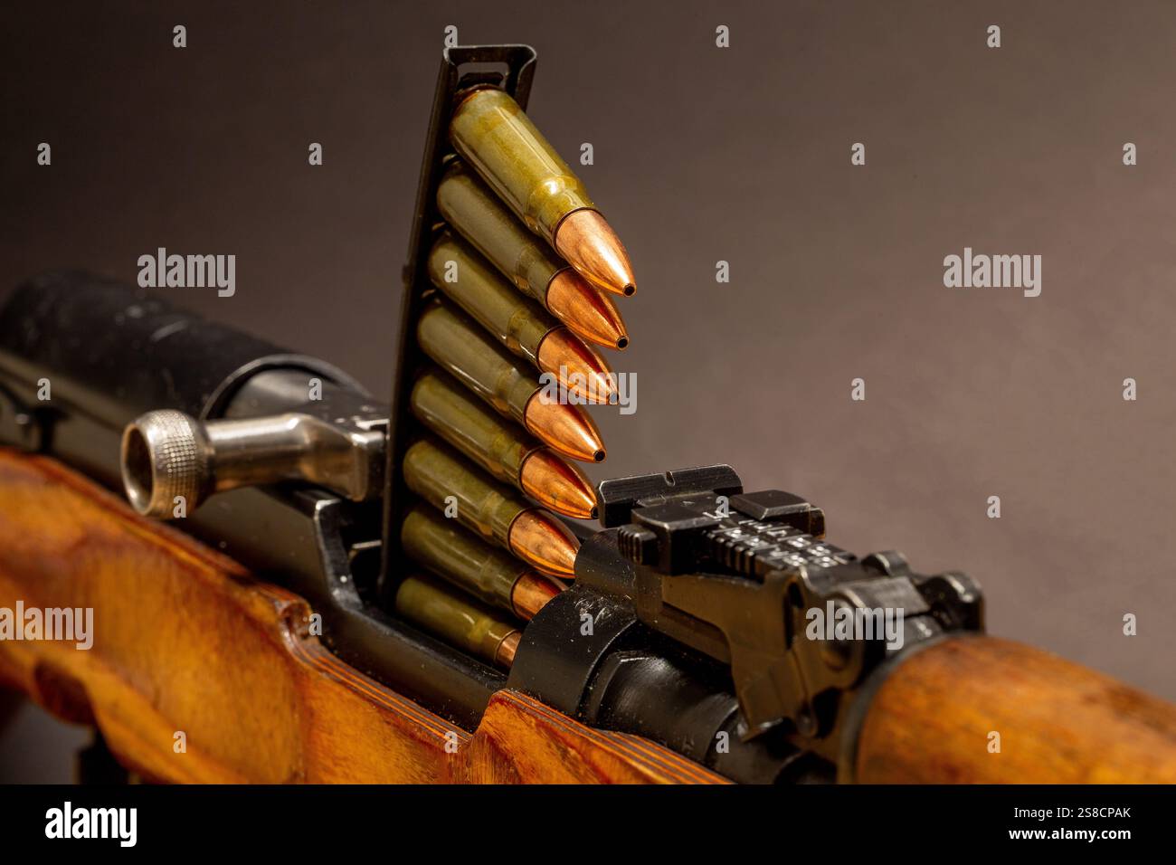 A close-up view of a classic semi-automatic rifle with a stripper clip ...