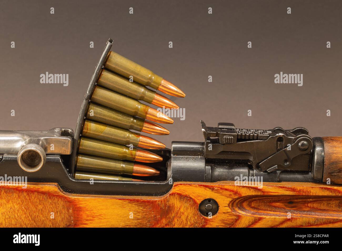 A close-up view of a classic semi-automatic rifle with a stripper clip ...