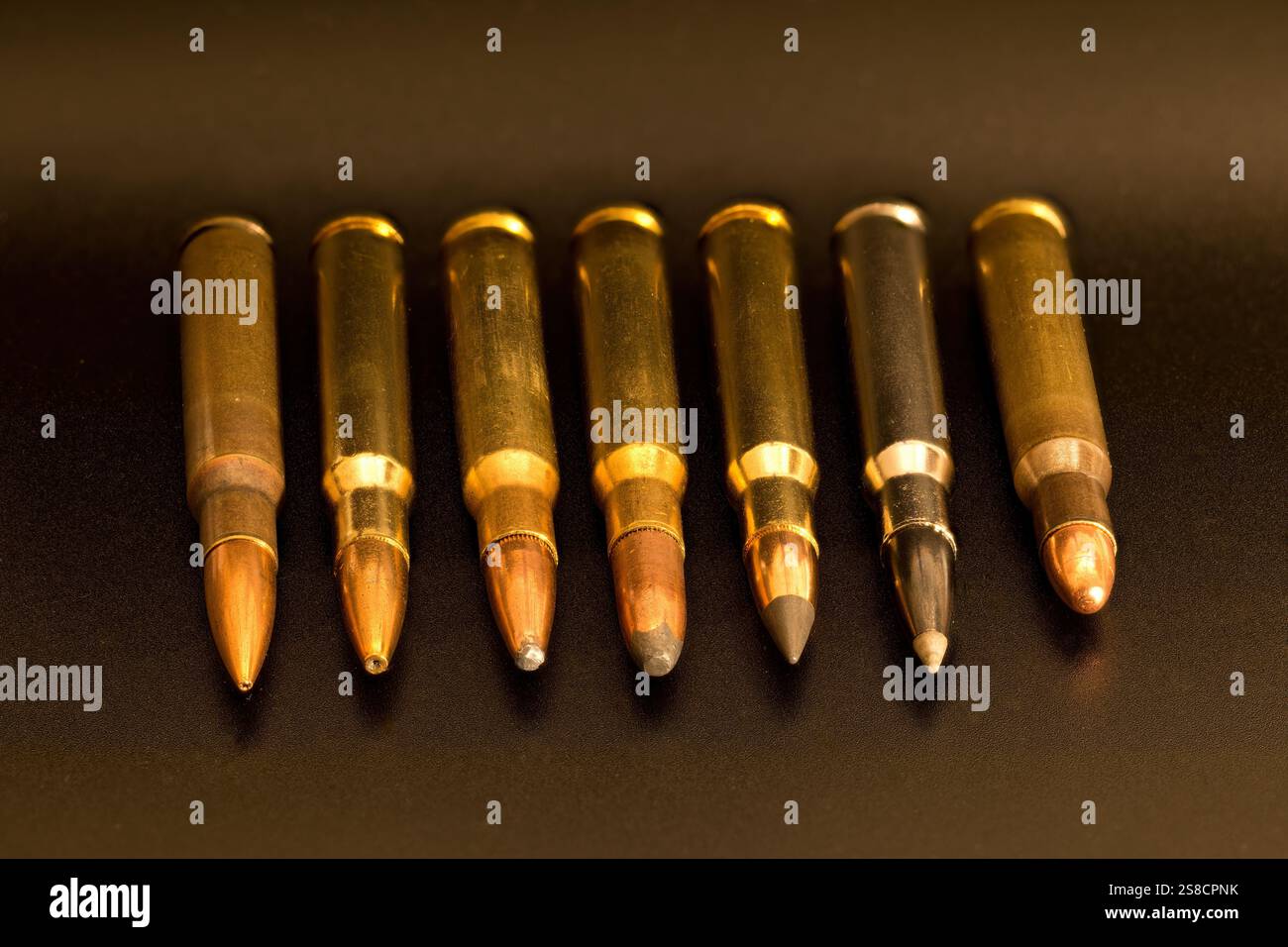 A detailed view of .30-06 rifle cartridges with distinctive tips ...