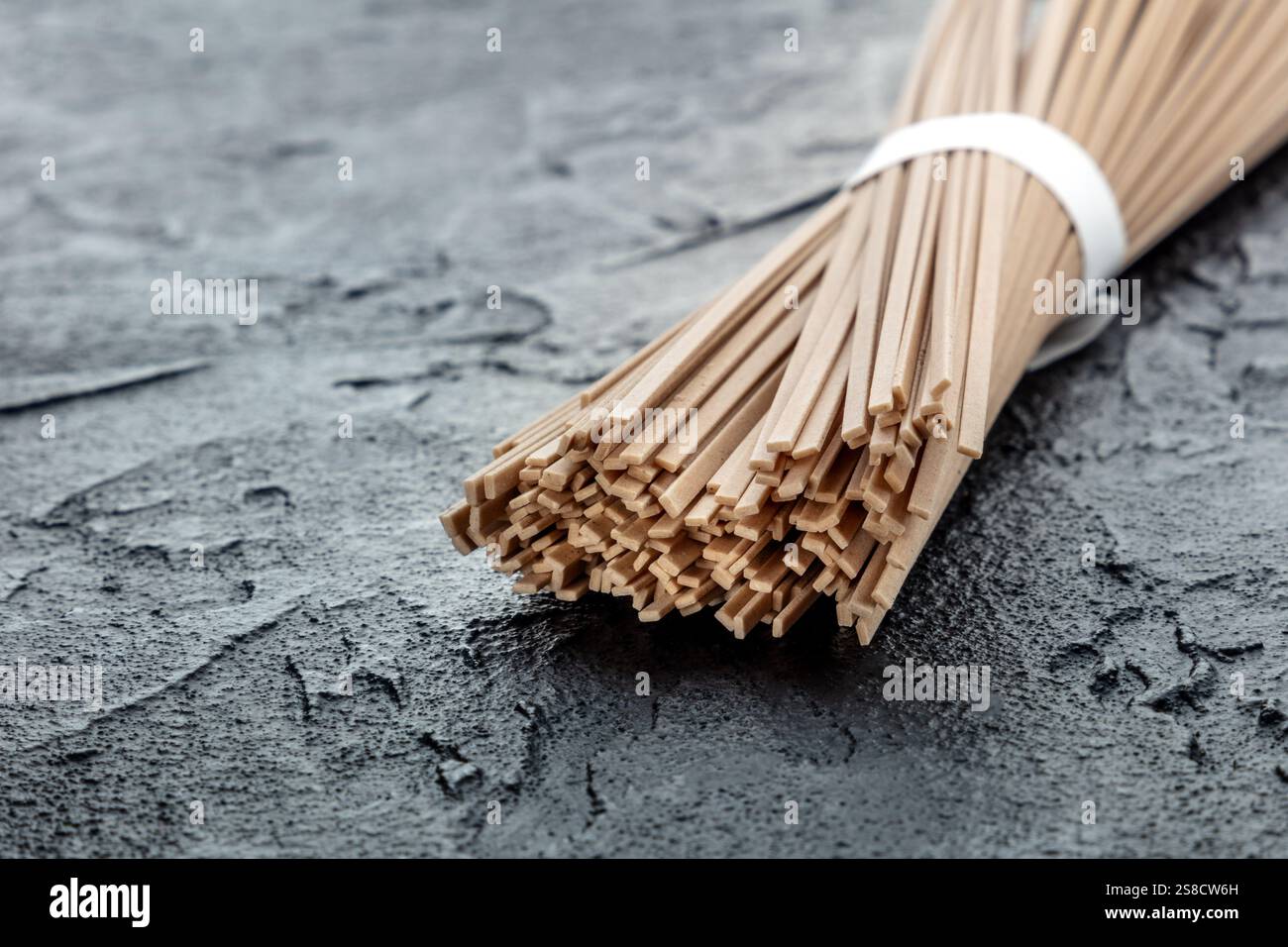Soba, Japanese buckwheat noodles, on a black background, a close-up ...