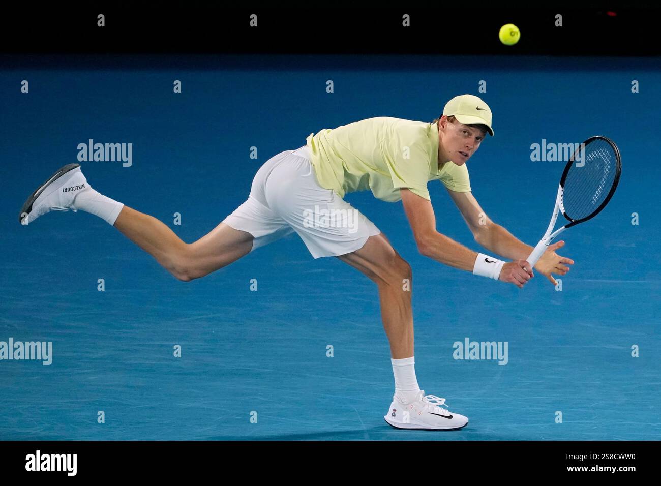 Jannik Sinner of Italy plays a backhand return to Alex de Minaur of ...