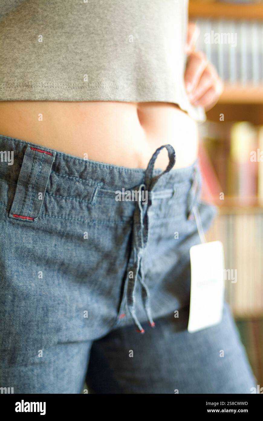Woman belly button jeans hi-res stock photography and images - Alamy