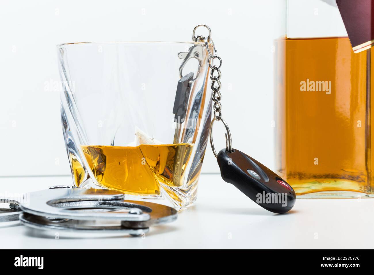 Car key on the bar with spilled alcohol Stock Photo - Alamy