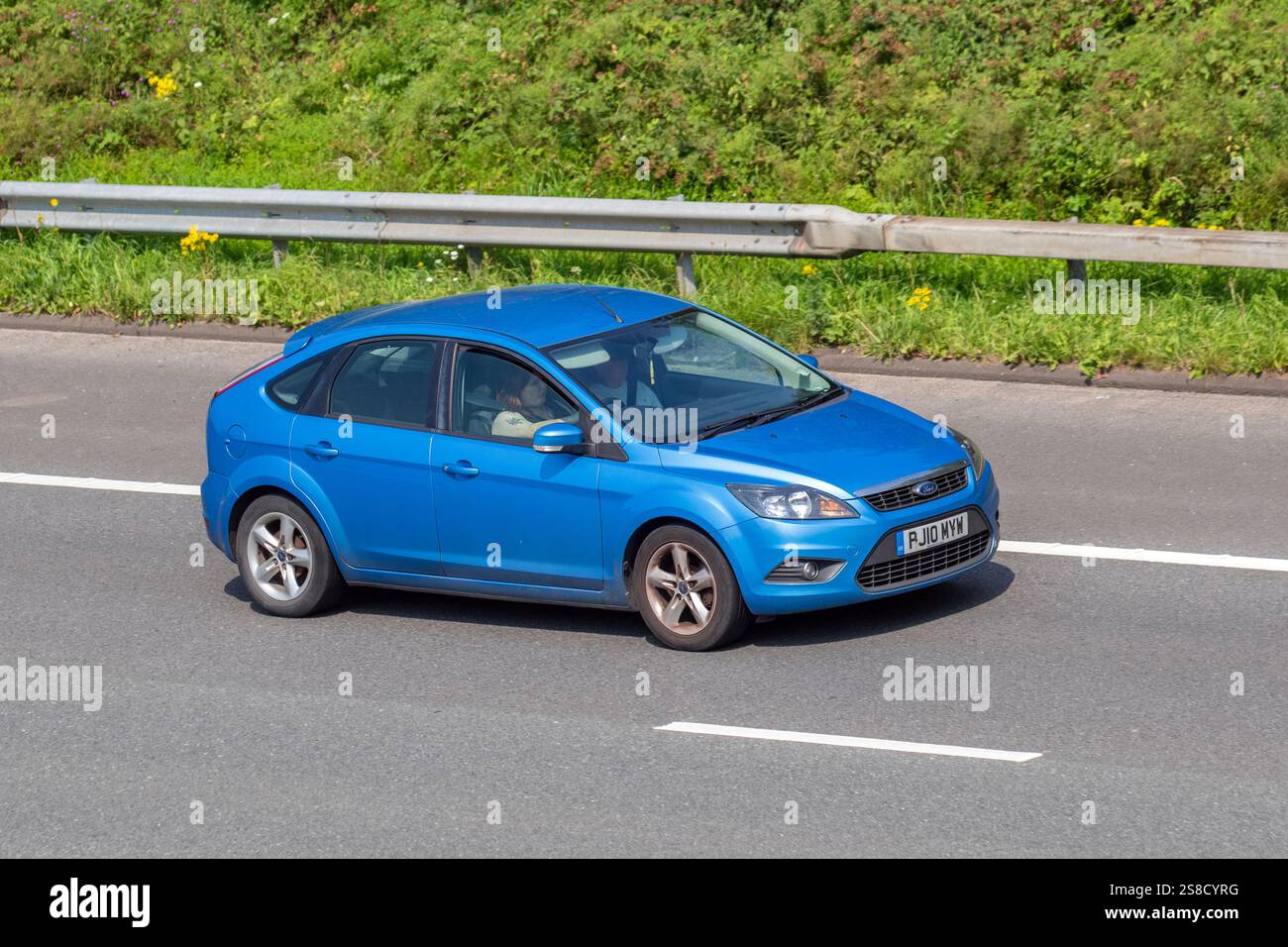 2010 Blue Ford Focus Zetec 100 5d hatchback travelling on the M6 ...