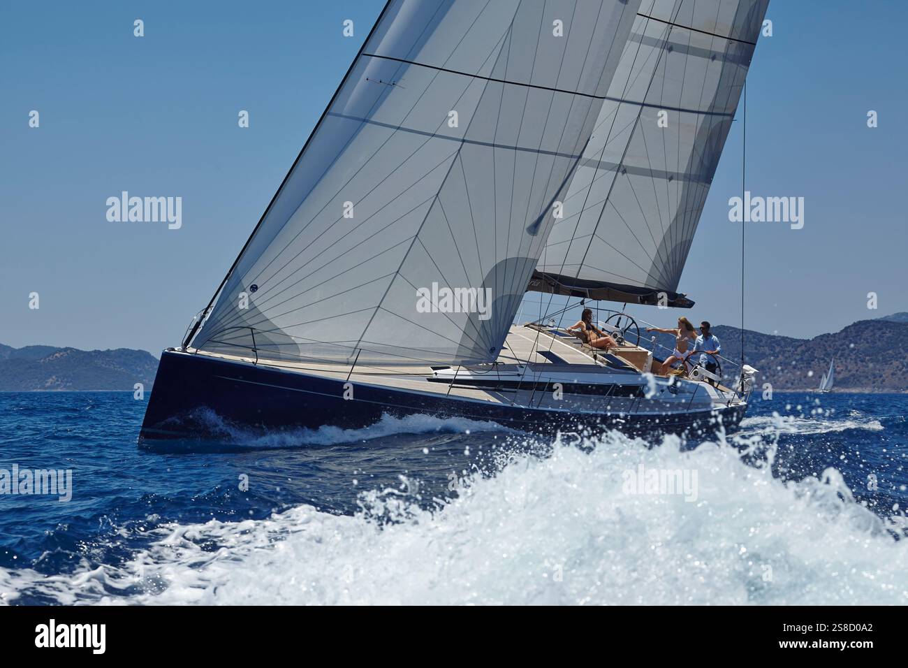 Sailboat Gliding Through Deep Blue Waters on a Sunny Summer Day Stock ...