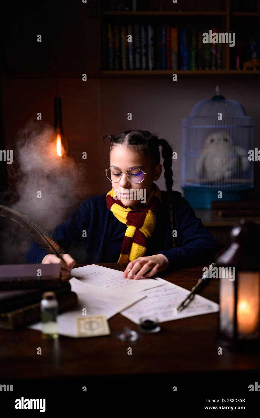 A girl's Harry Potter cosplay. Writing a letter with candles and an owl ...