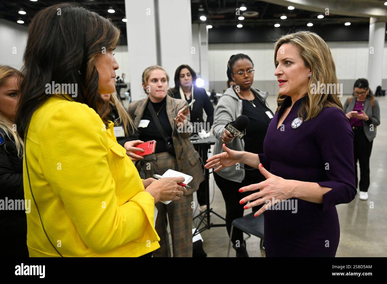 FILE - Michigan Secretary of State Jocelyn Benson, right, talks to the ...