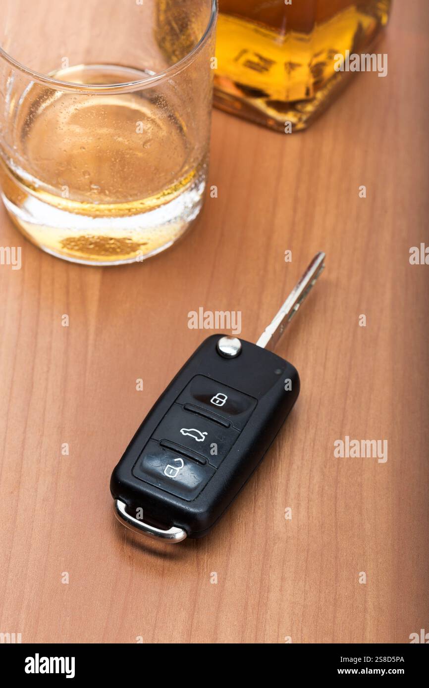 Car key on the bar with spilled alcohol Stock Photo - Alamy
