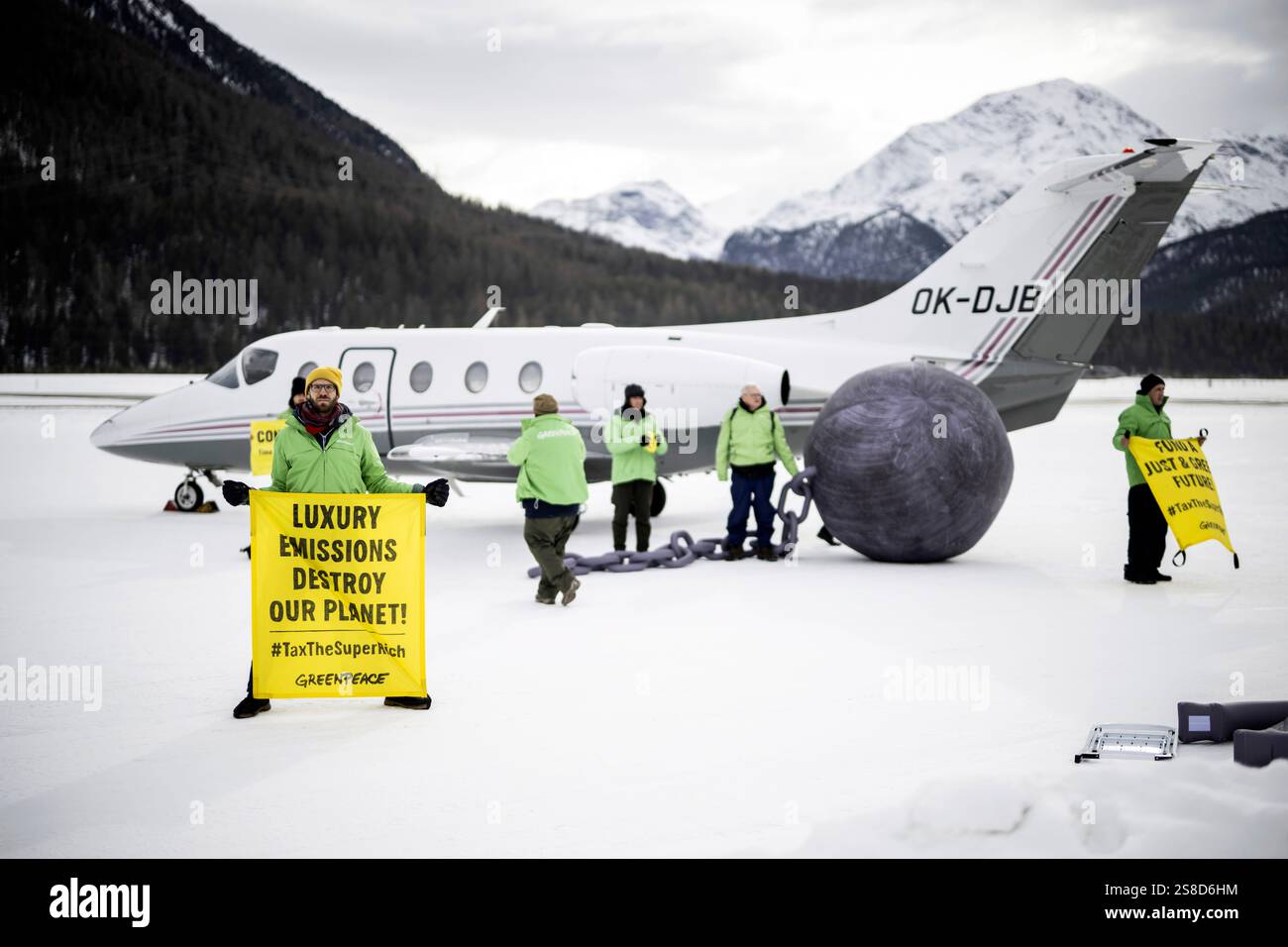 Greenpeace activists stage a protest asking for higher taxes for the ...