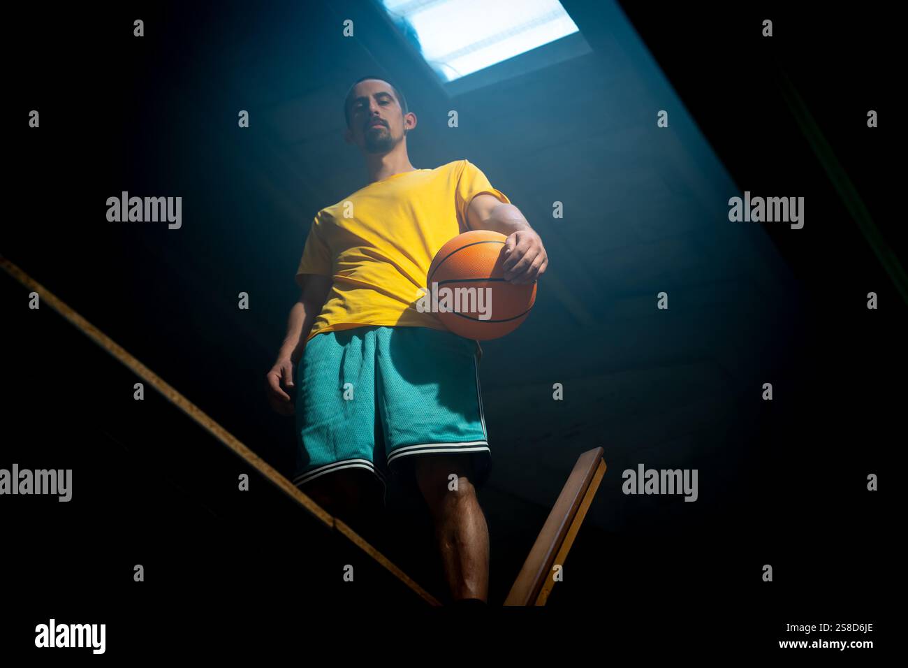 A basketball player intensely focused in dramatic and captivating ...