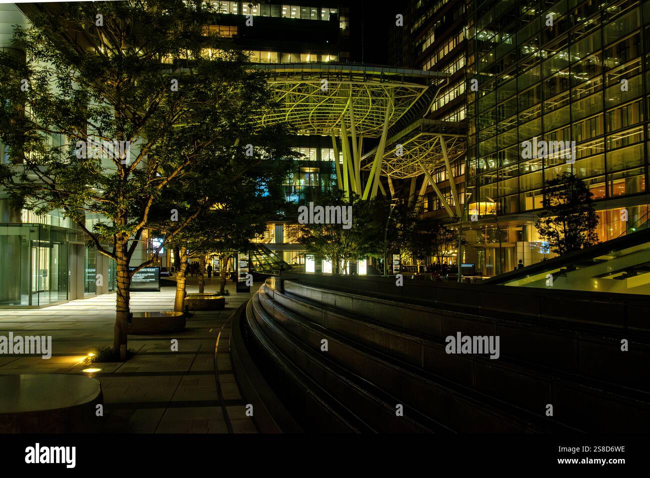 A night time image of the architecture within the Tokyo Midtown ...