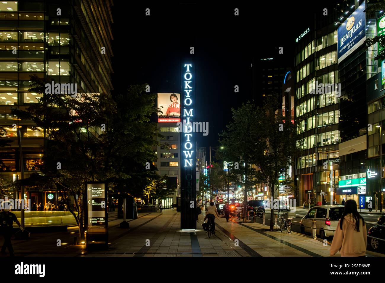 A night time street scene outside the Tokyo midtown development near ...