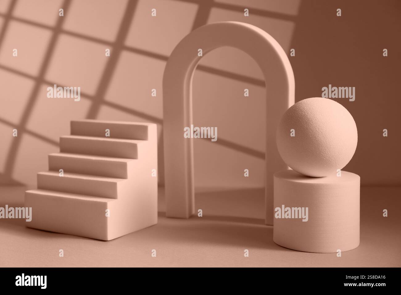 Different geometric shapes on color background, toned in mocha mousse ...