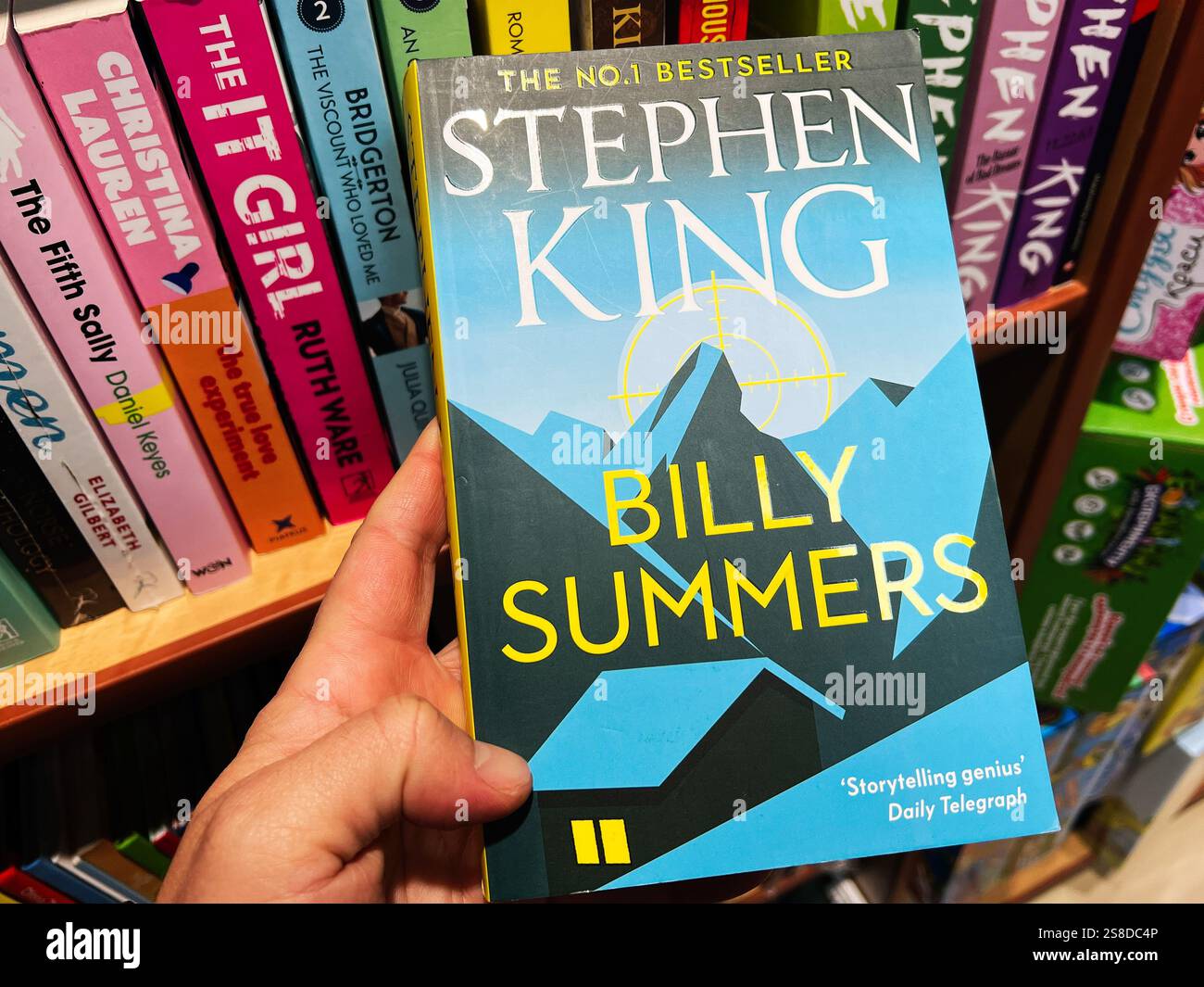 Kyiv, Ukraine - January 21, 2025: A person holds a popular Stephen King ...