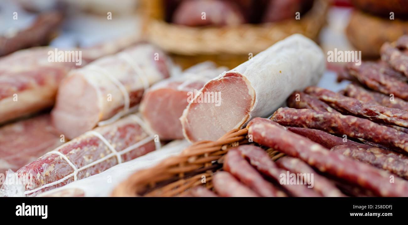 Selection of assorted home made meats, jerky and sausages on a farmers ...