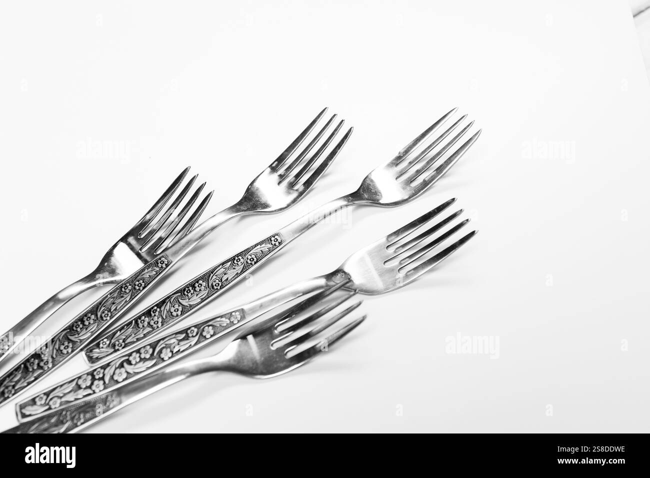 Old metal forks isolated on a white background Stock Photo - Alamy