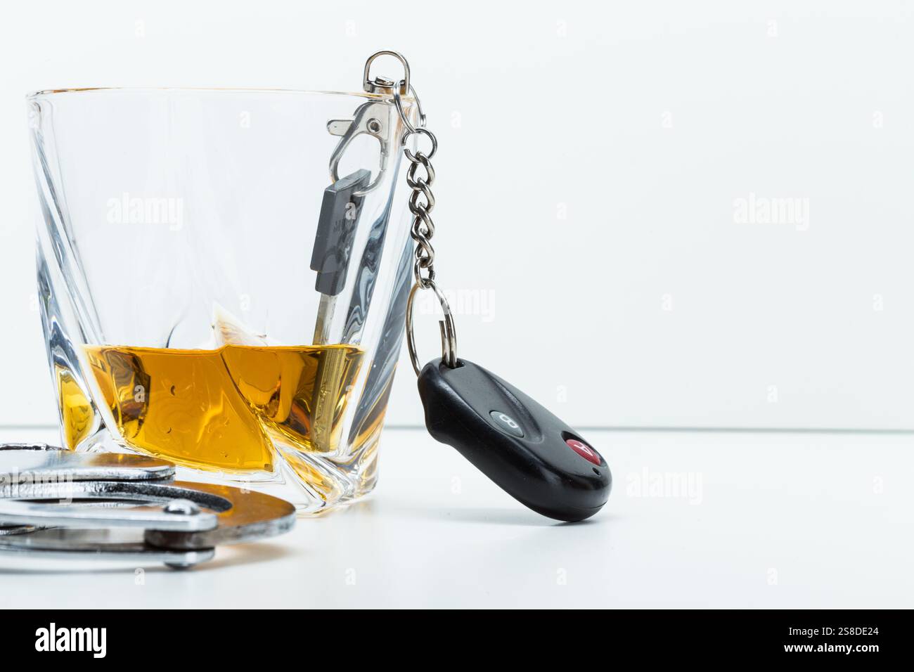 Car key on the bar with spilled alcohol Stock Photo - Alamy
