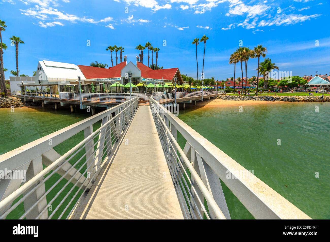 Wooden boardwalk leading to covered patio on coastal beach in San Diego ...