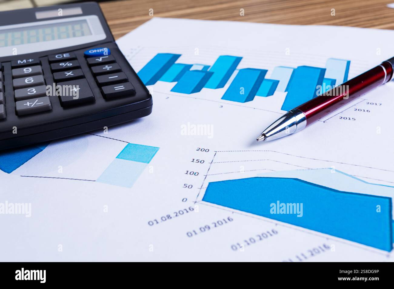 Graphs and Calculator Stock Photo - Alamy