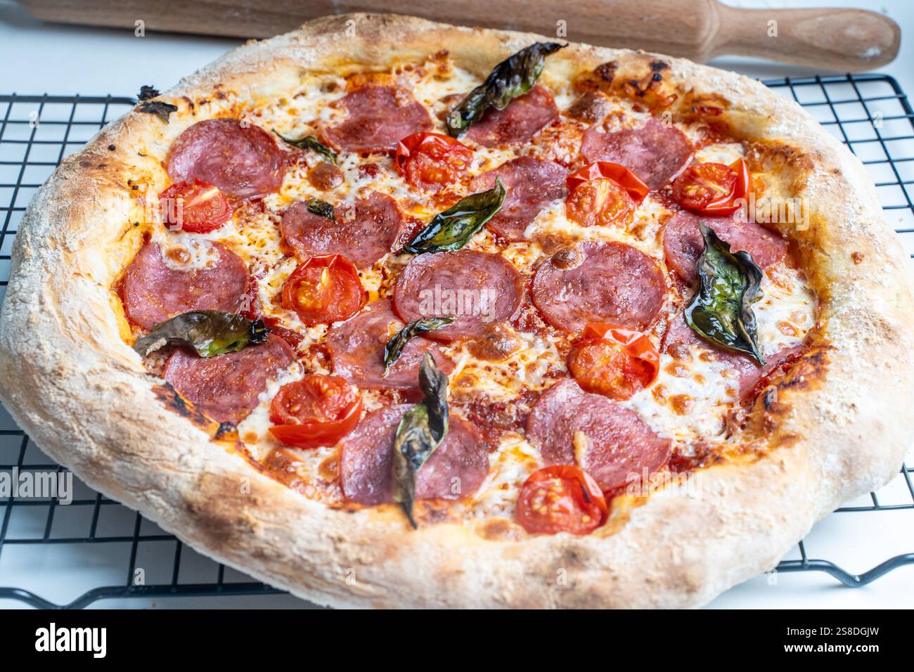 Raw pepperoni pizza is ready to cook. Pizza with sausage, tomatoes ...