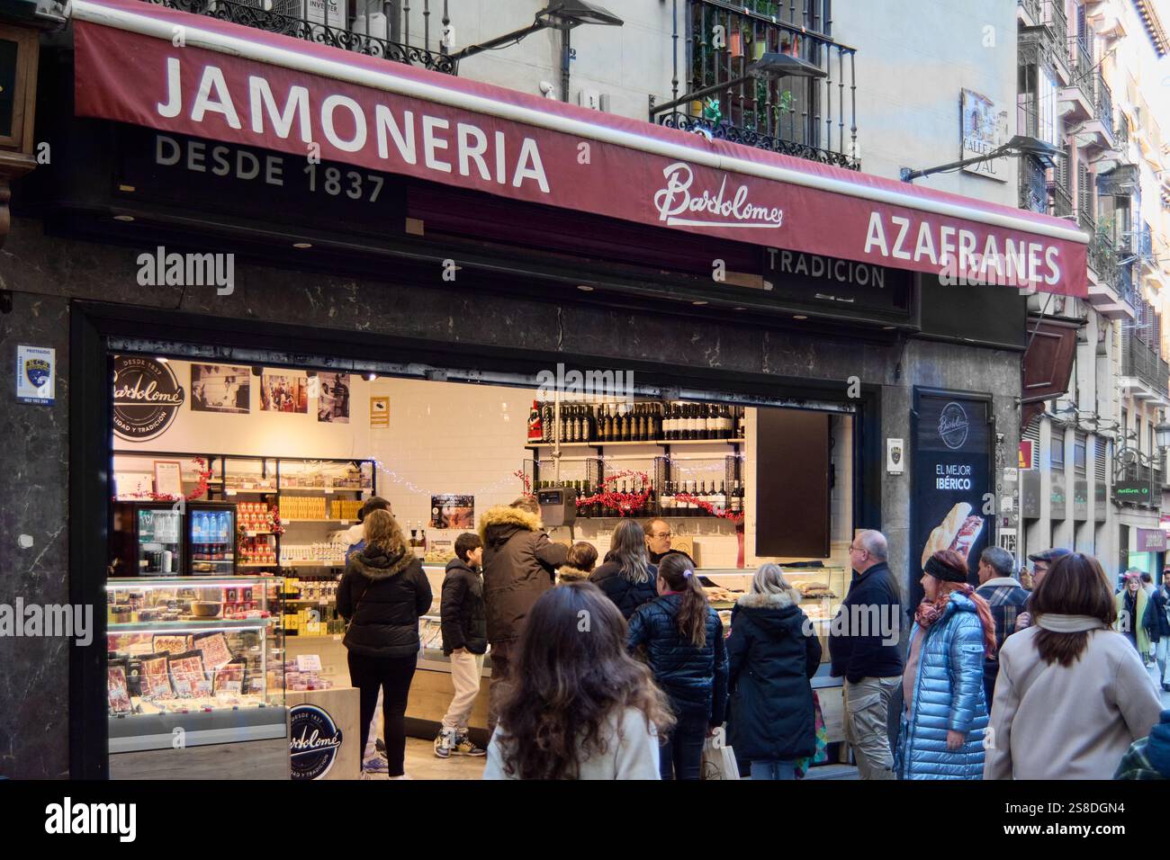 Madrid. Spain - January 22, 2025: A bustling traditional Spanish deli ...