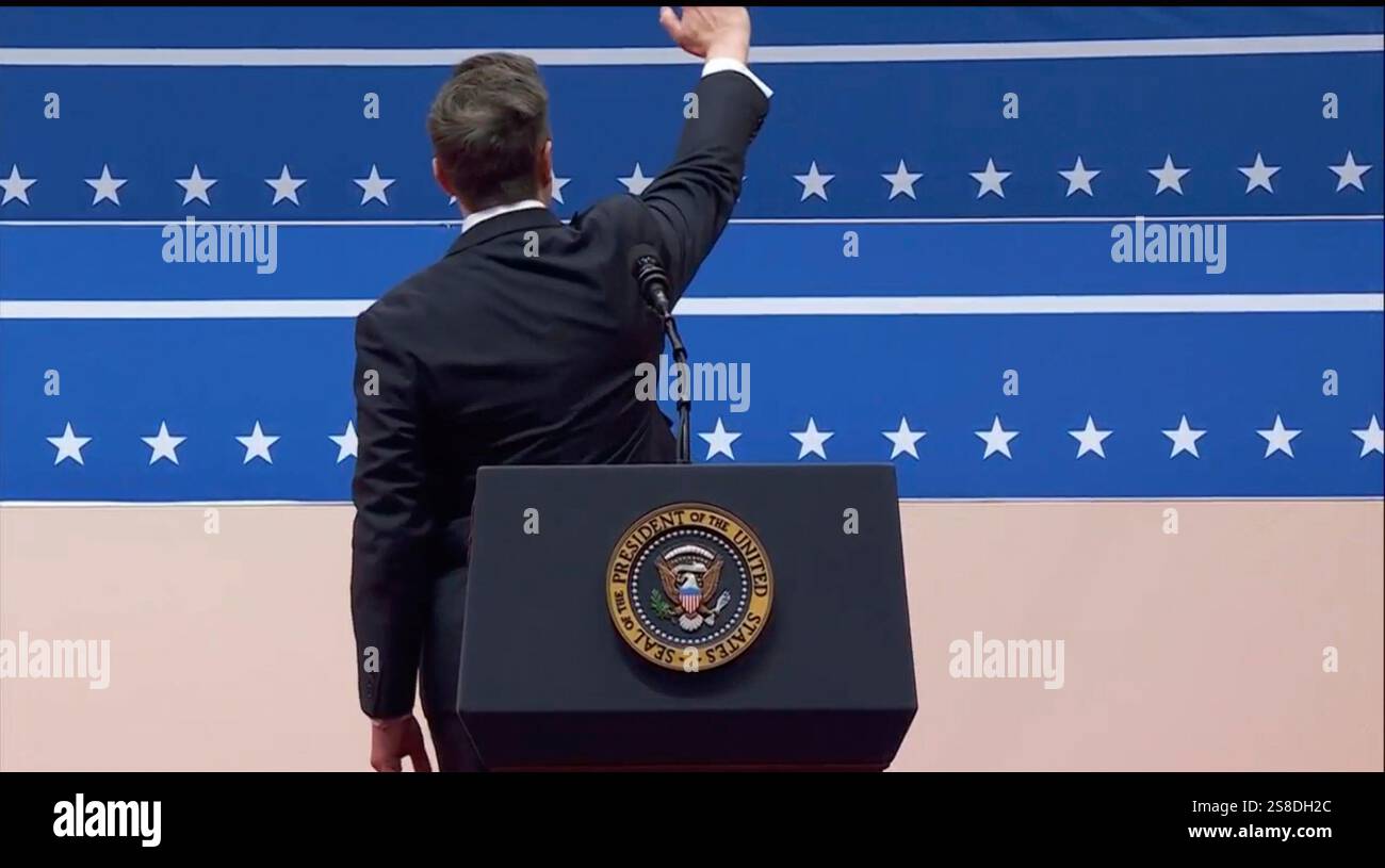 Elon Musk gestures while speaking at an indoor Presidential ...
