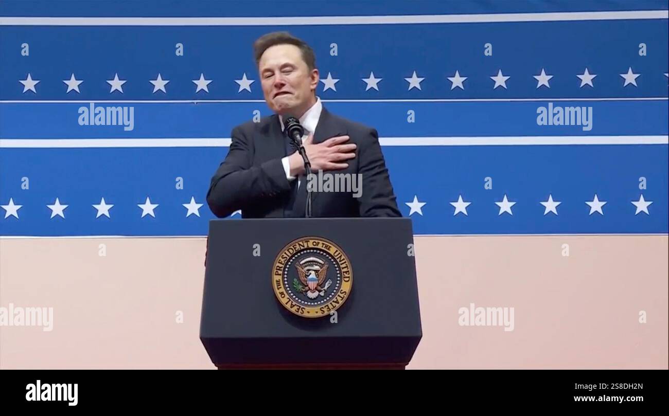 Elon Musk gestures while speaking at an indoor Presidential ...