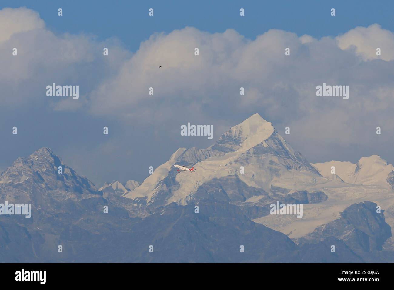 Kathmandu, Nepal. 23rd Jan, 2025. An aircraft soars against the ...