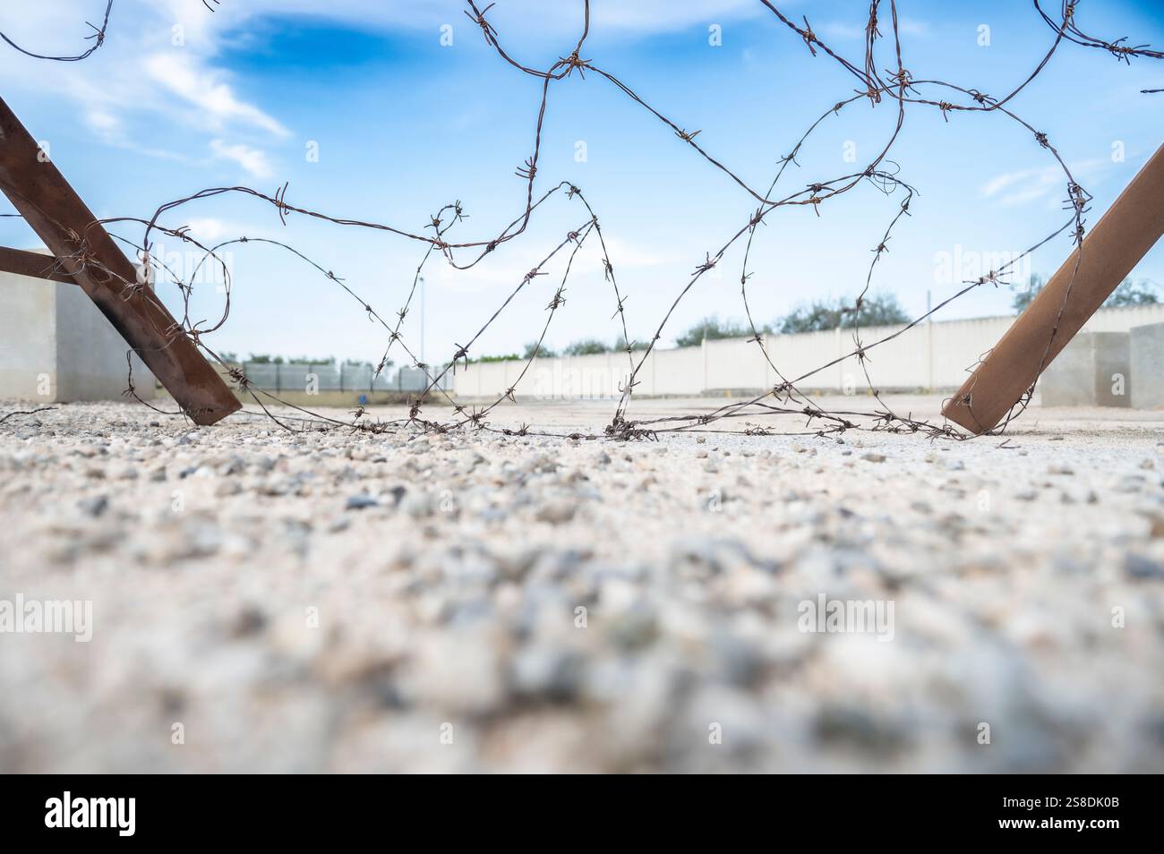Road fence with barbed wire Stock Photo - Alamy