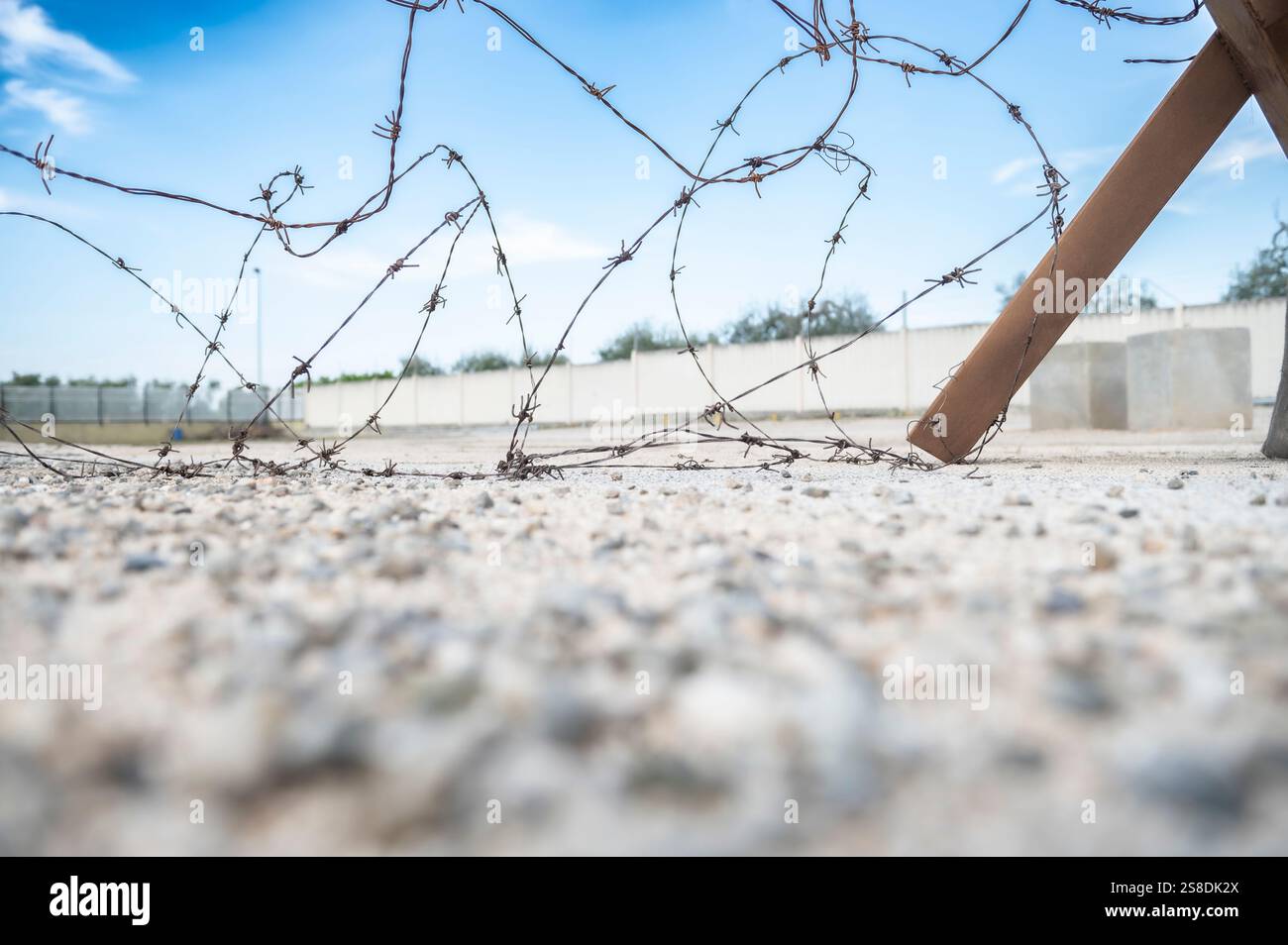 Road fence with barbed wire Stock Photo - Alamy