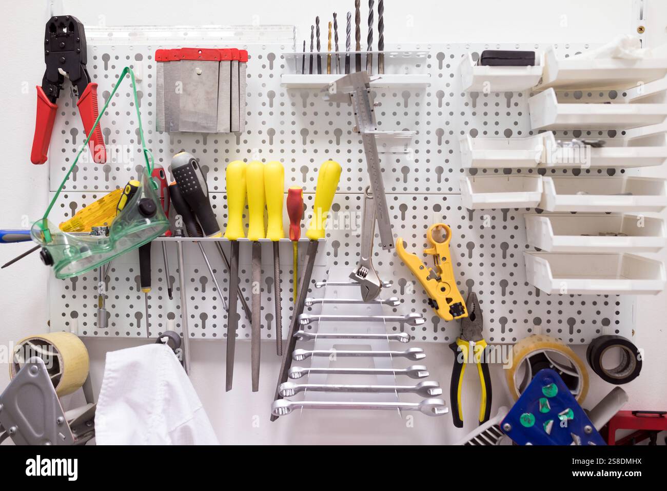 Picture of working tools hanging on wall Stock Photo - Alamy