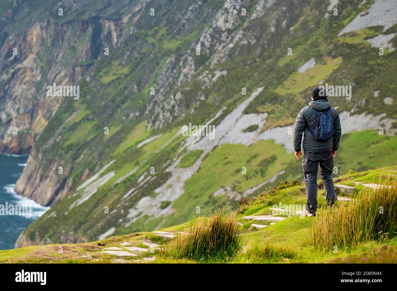 Tourist at Slieve League, Irelands highest sea cliffs, located in south ...