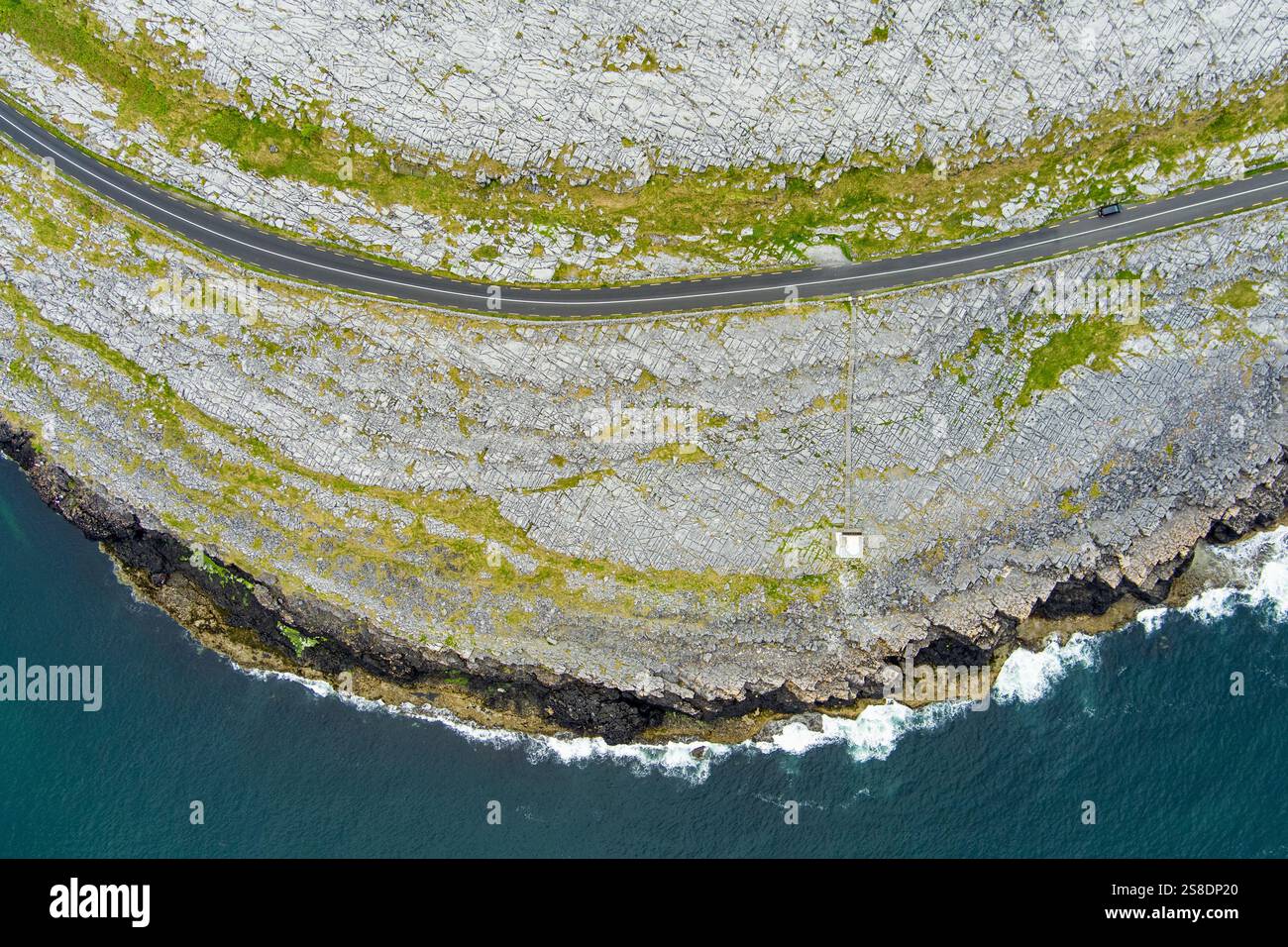 Black Head Lighthouse, situated in the rough rocky landscape of Burren ...
