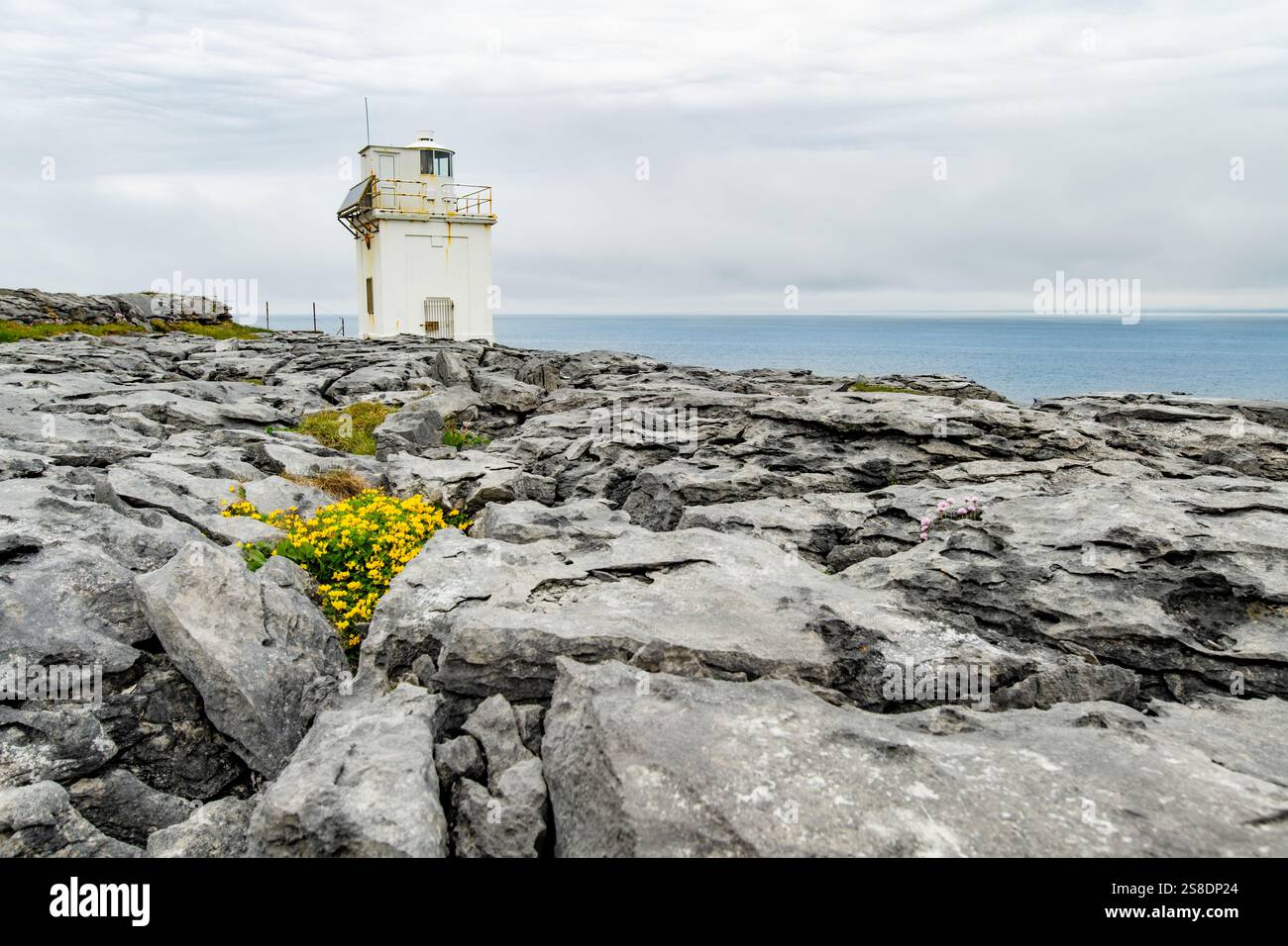 Black Head Lighthouse, situated in the rough rocky landscape of Burren ...
