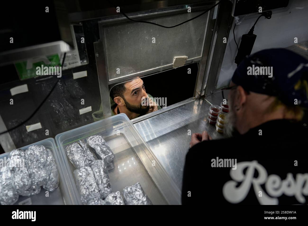 World Central Kitchen Chef Corp member Daniel Shemtob, left, talks with ...