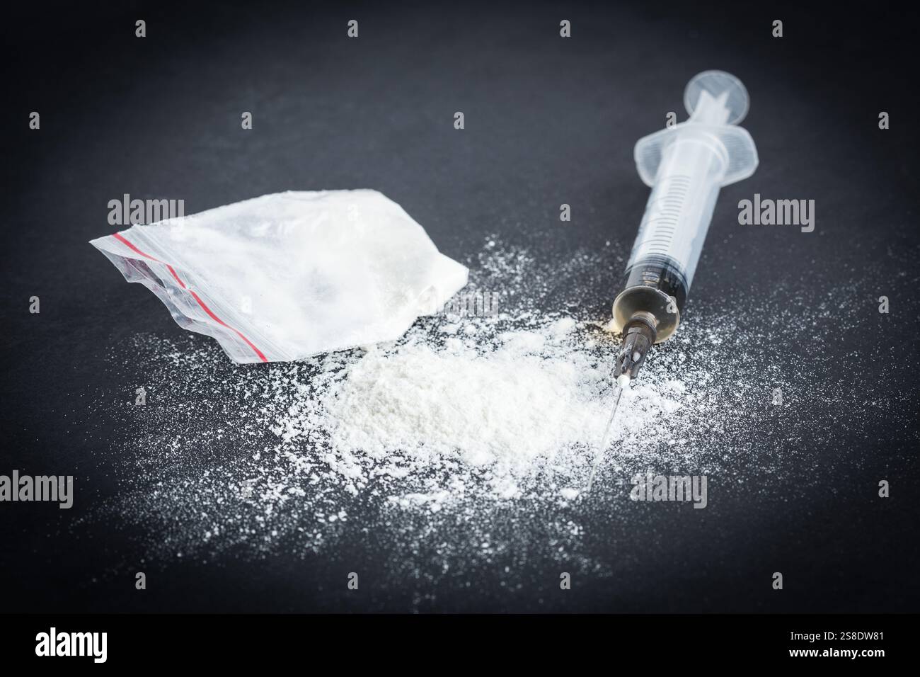 Drug syringe and cooked heroin Stock Photo - Alamy