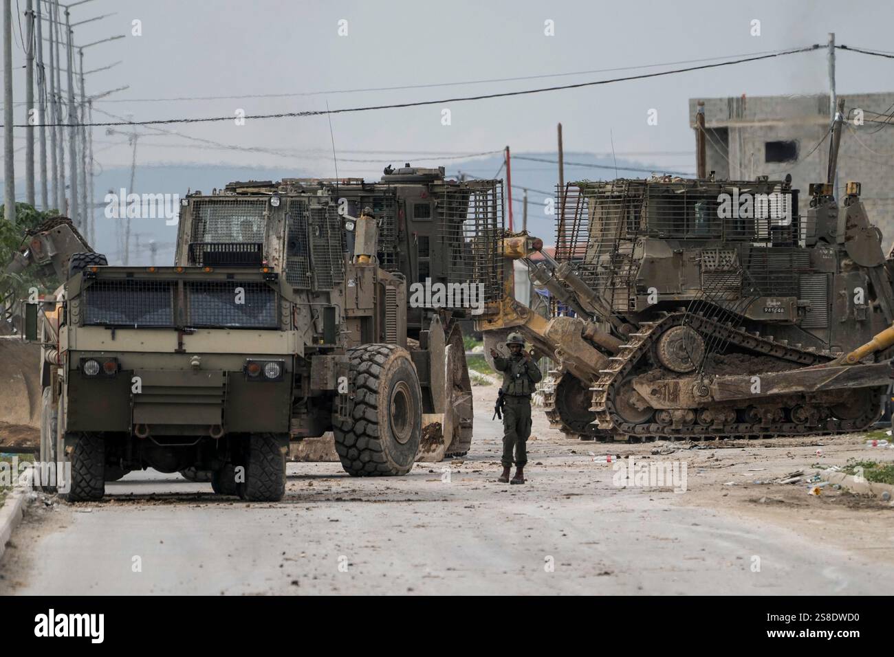 Israeli army vehicles are seen during a military operation in the West ...
