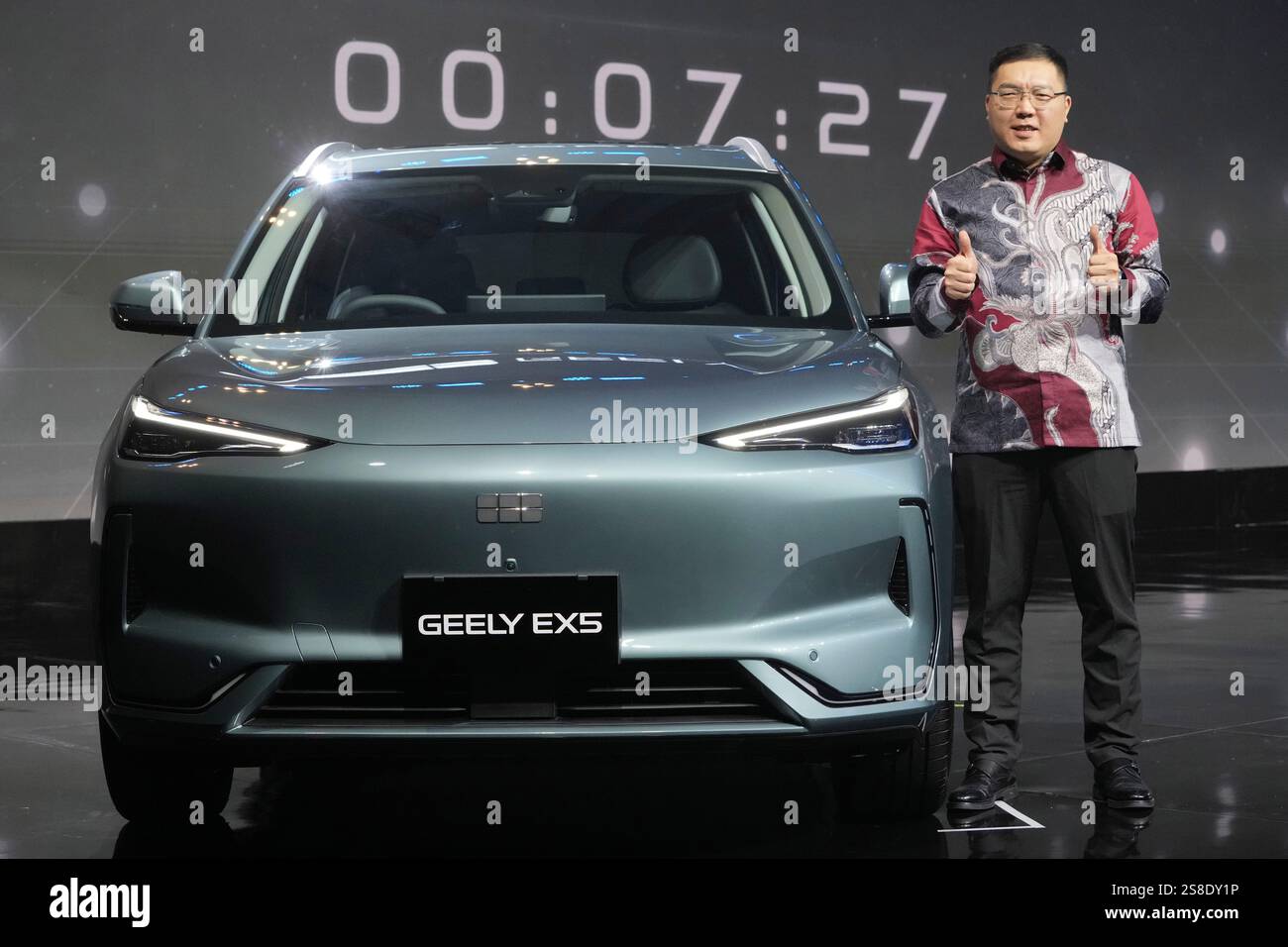 CEO Geely Auto Indonesia Victor Gao stands next to a Geely EX5 electric car during Geely auto ...