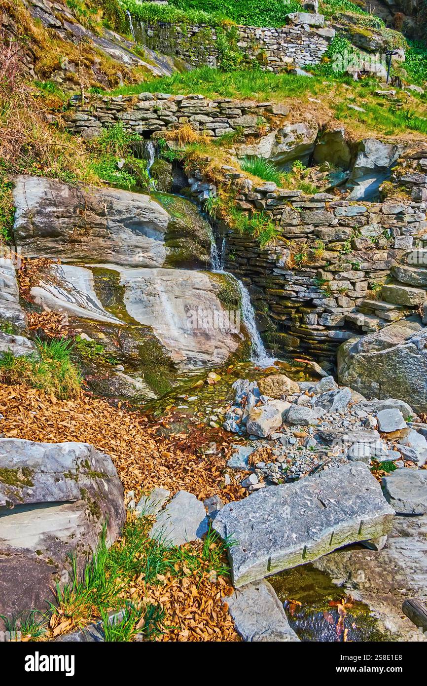 The narrow curved Ri del Ronchetto stream, flowing from the Pizzo di ...