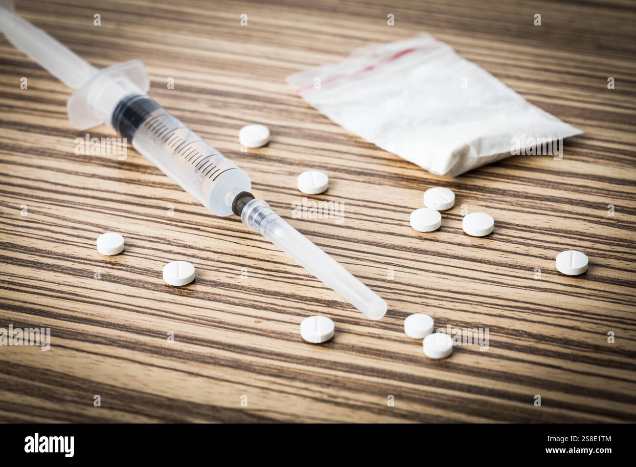Still life drugs and syringe on table Stock Photo - Alamy
