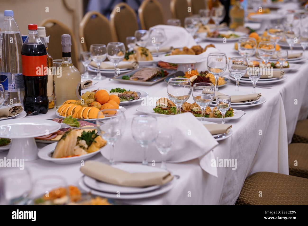 Elegant Banquet Table Set with Assorted Dishes and Drinks Stock Photo - Alamy