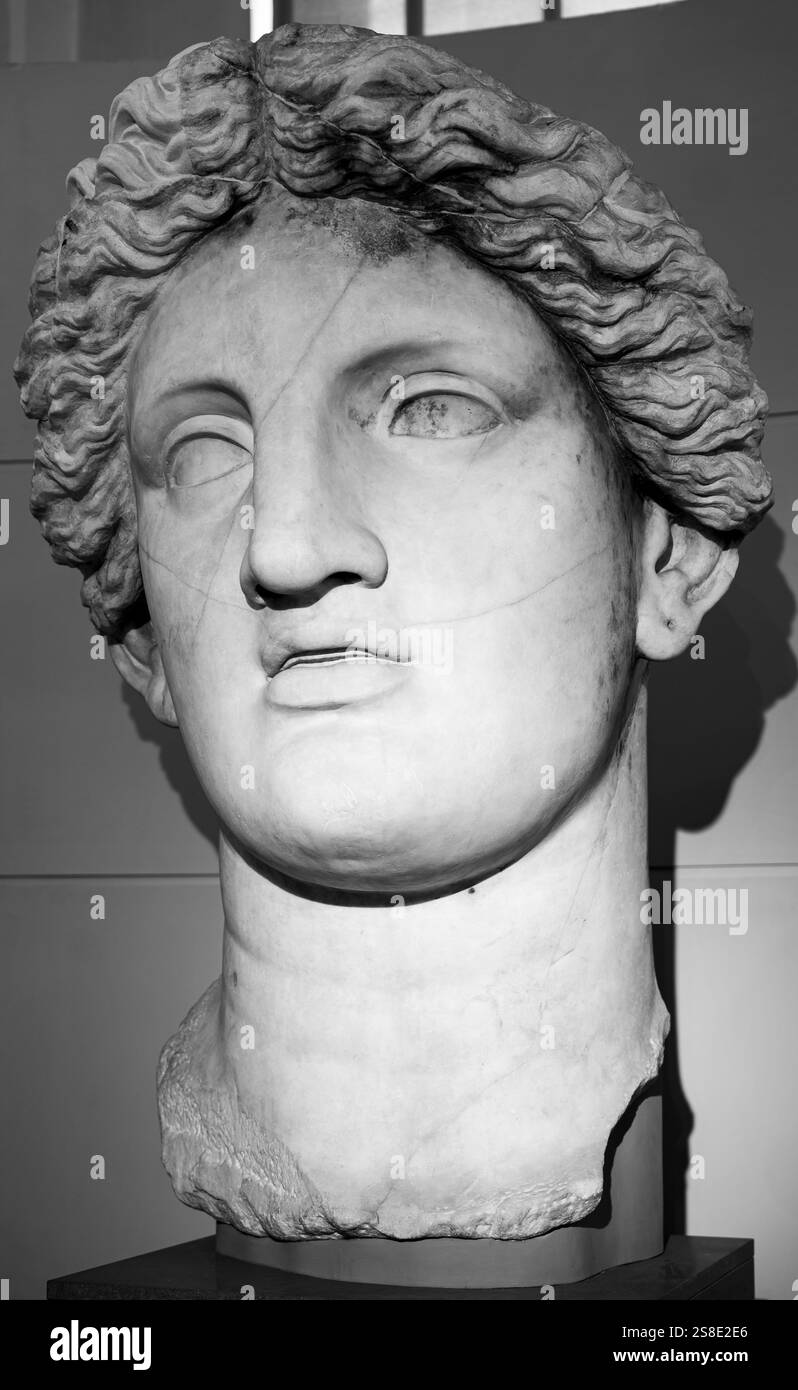 Black and white photo showing in close-up a giant ancient roman male ...
