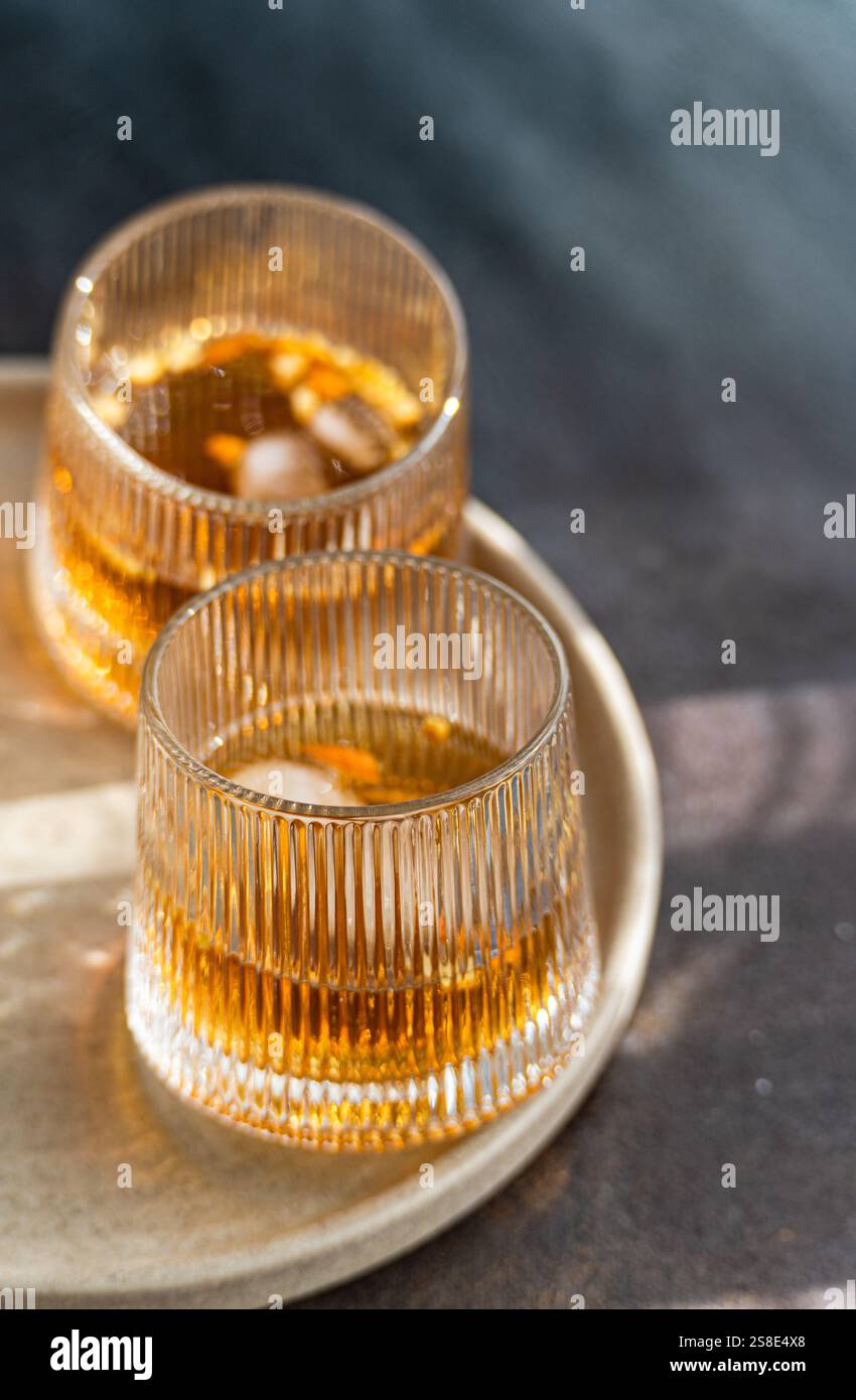 Two glasses of spiced cognac cocktail with cinnamon and star anise ...